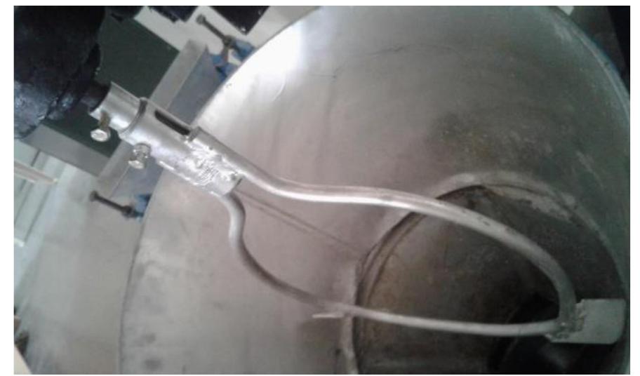 Fabricated hopper with a blade acts as an atta mixer.