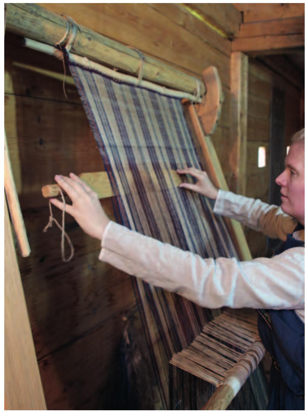 Experiment using a weaving sword with a warp-weighted loom.