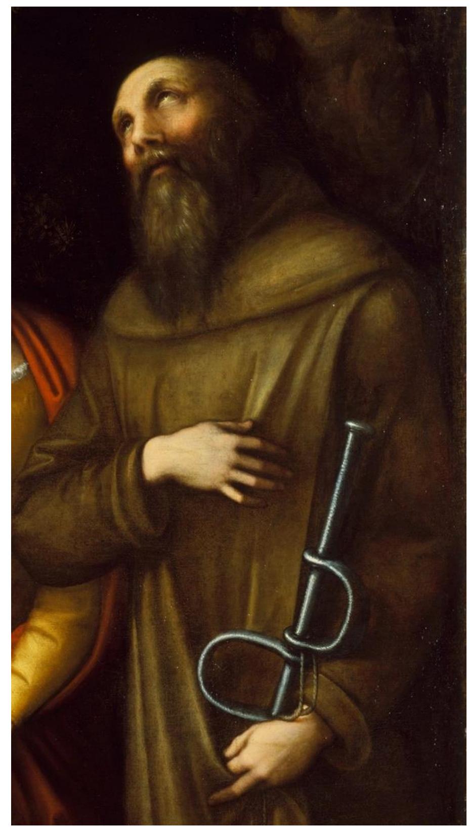 St. leonard holding a set of bilboes-style restraints.