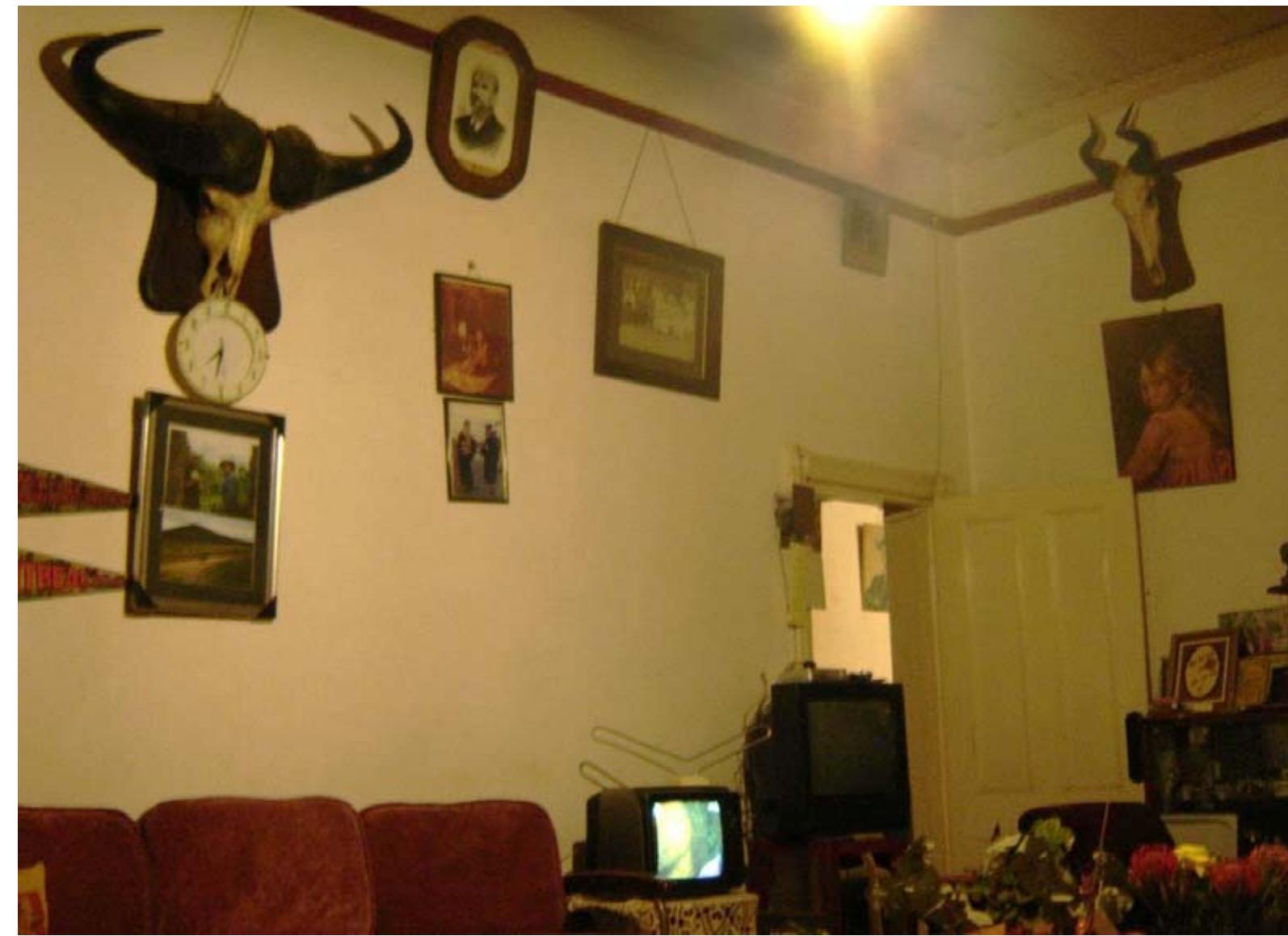 Lounge of mr. and mrs. n.f. strydom. john dunn’s photo hangs