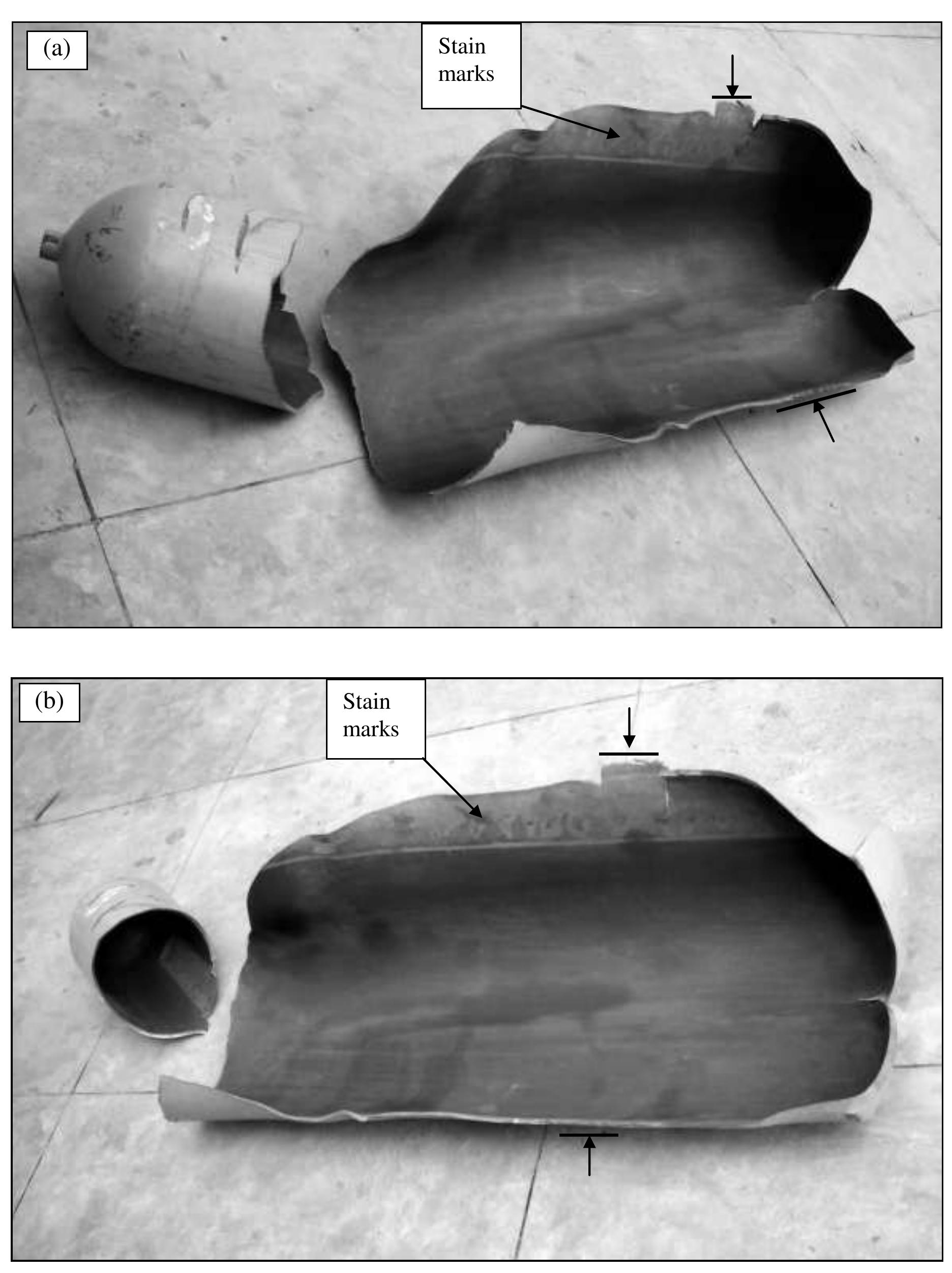 Zb) photographs of the ruptured cylinder indicating (with an