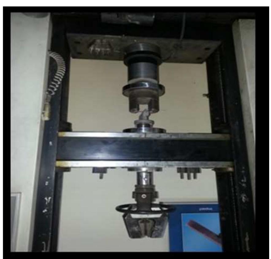 Specimen under test on an universal testing machine. figure