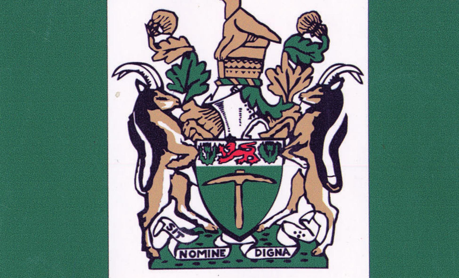 The rhodesian flag and coat of arms from 1965