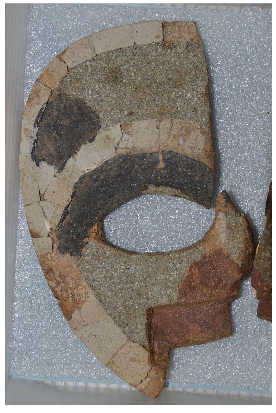 A mask from the nmai stolper collection, showing the gritty