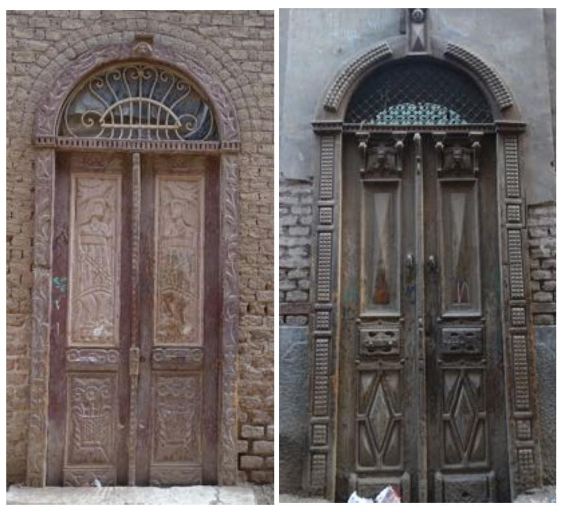 Traditional wooden carved doors with ironwork window on