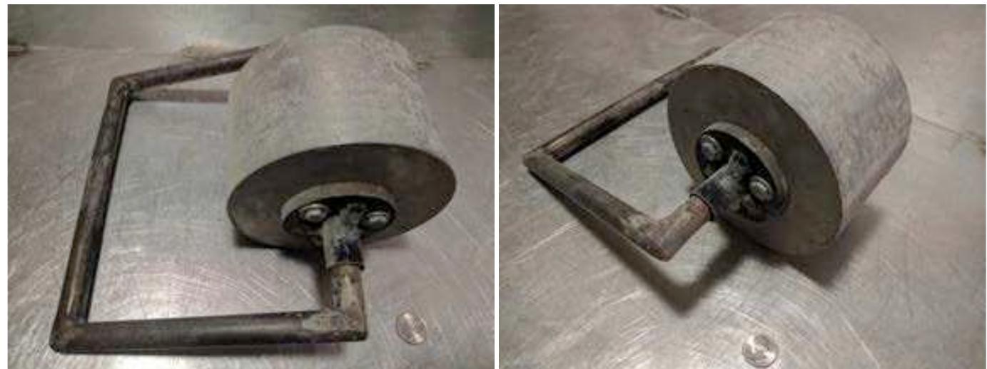 Hand-held roller for compacting pervious concrete cylinders.