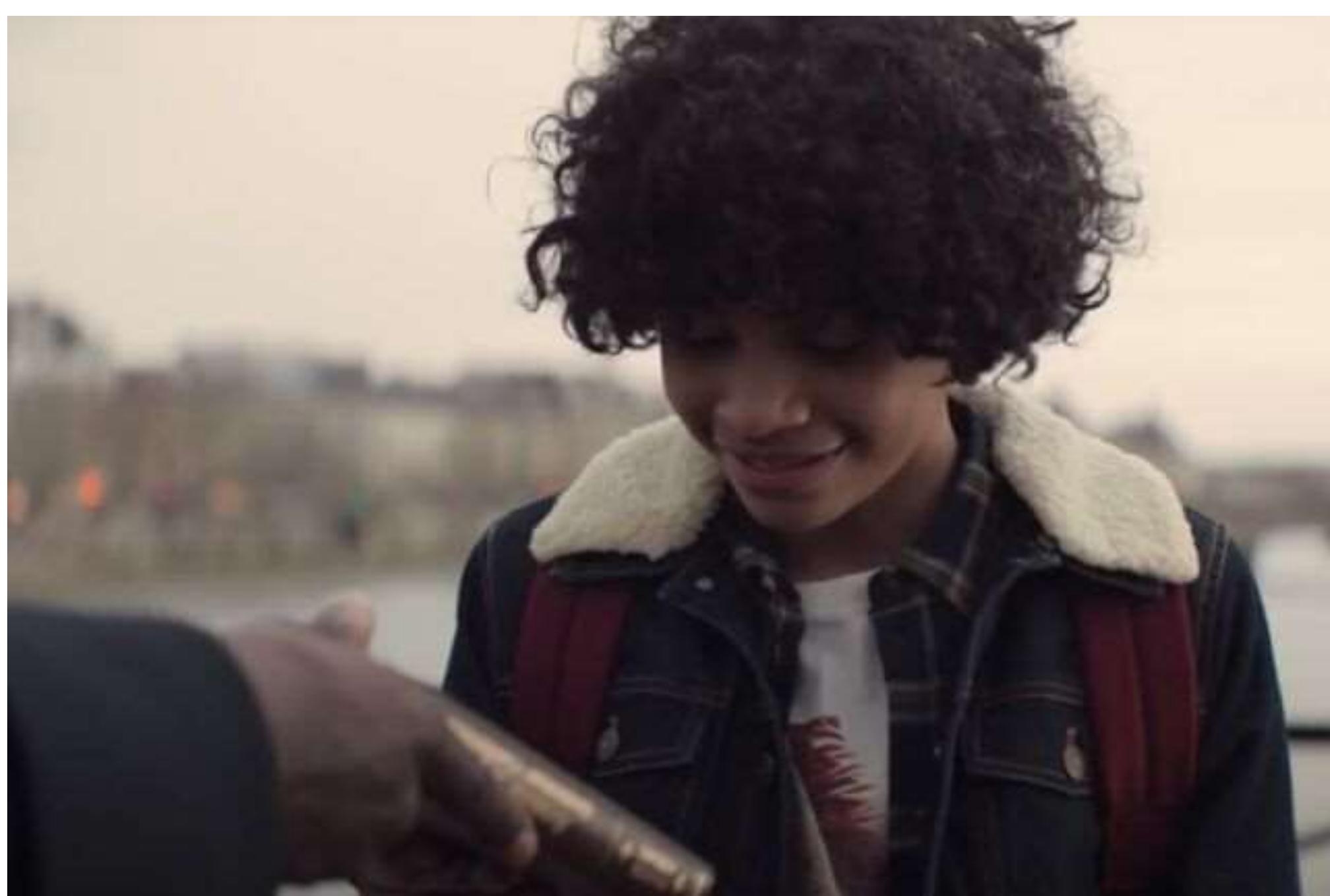 Image 7. assane diop (omar sy) renders his son raoul (etan