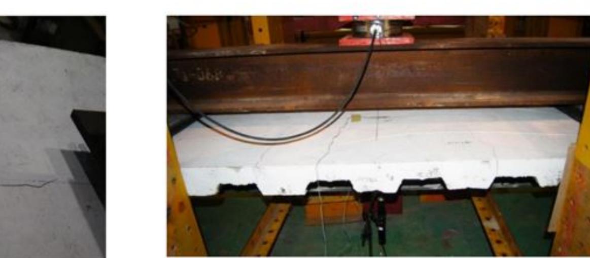 B) transverse crack at shear span d) transverse cracks at