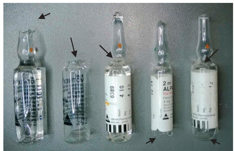 Some ampoule defects. from left to right: broken top (small,