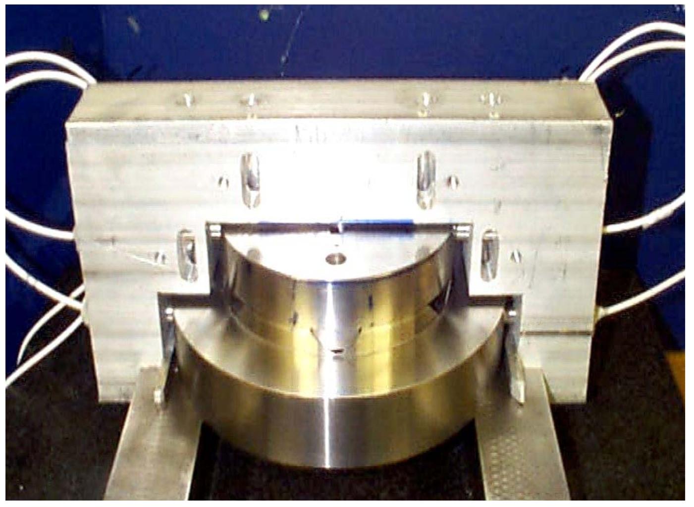 A three groove kinematic coupling with canoe balls.
