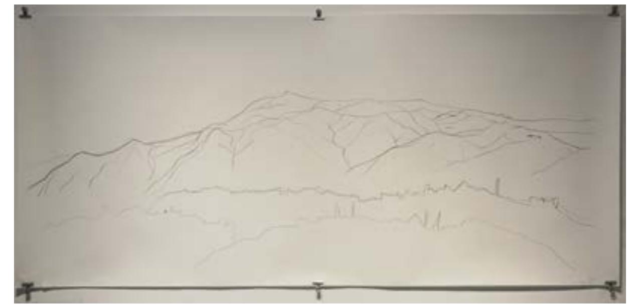 Line drawing the gap, showing arad’s skyline and the desert