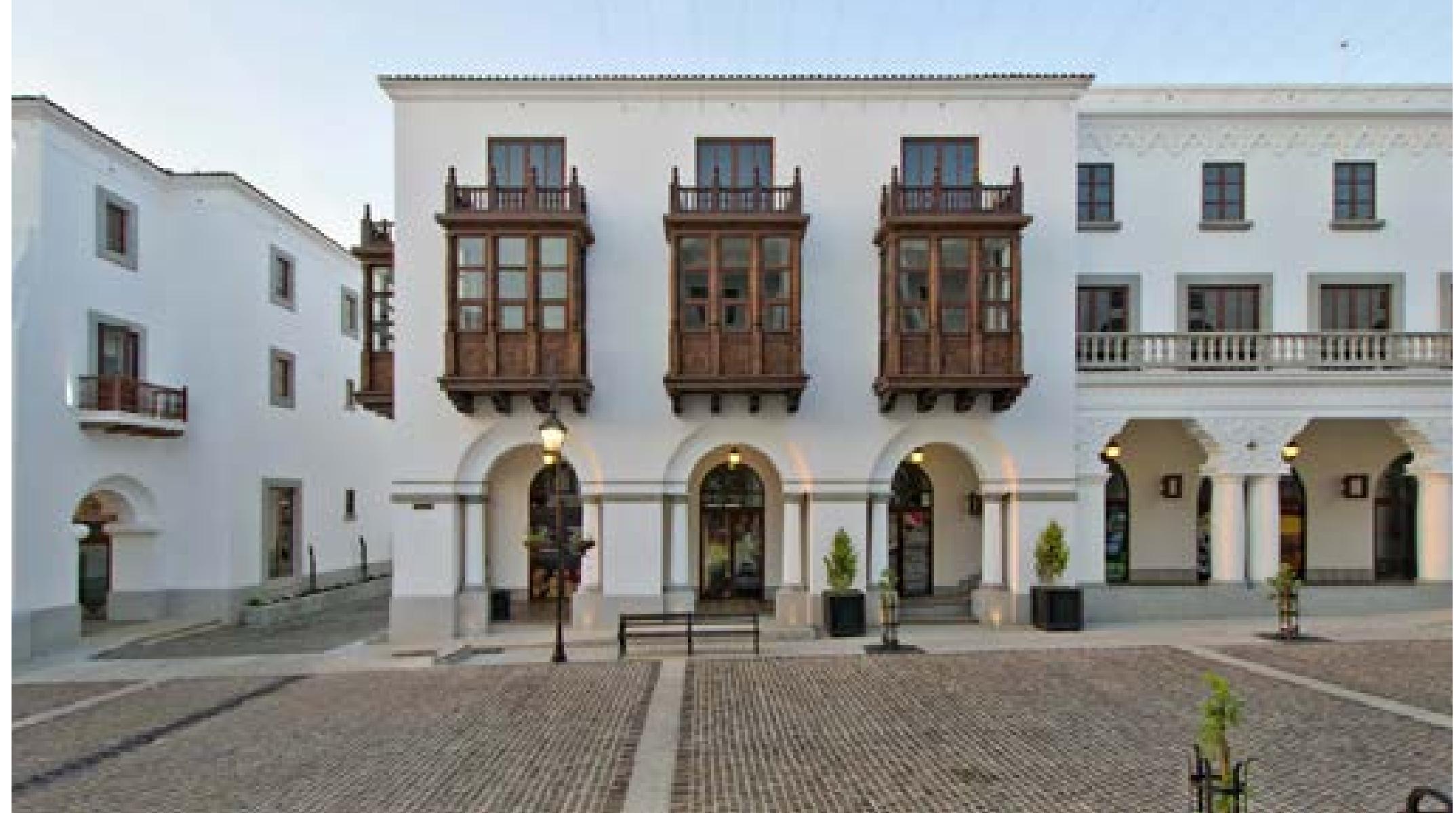 Mudéjar-inspired mixed-use building, with integrated