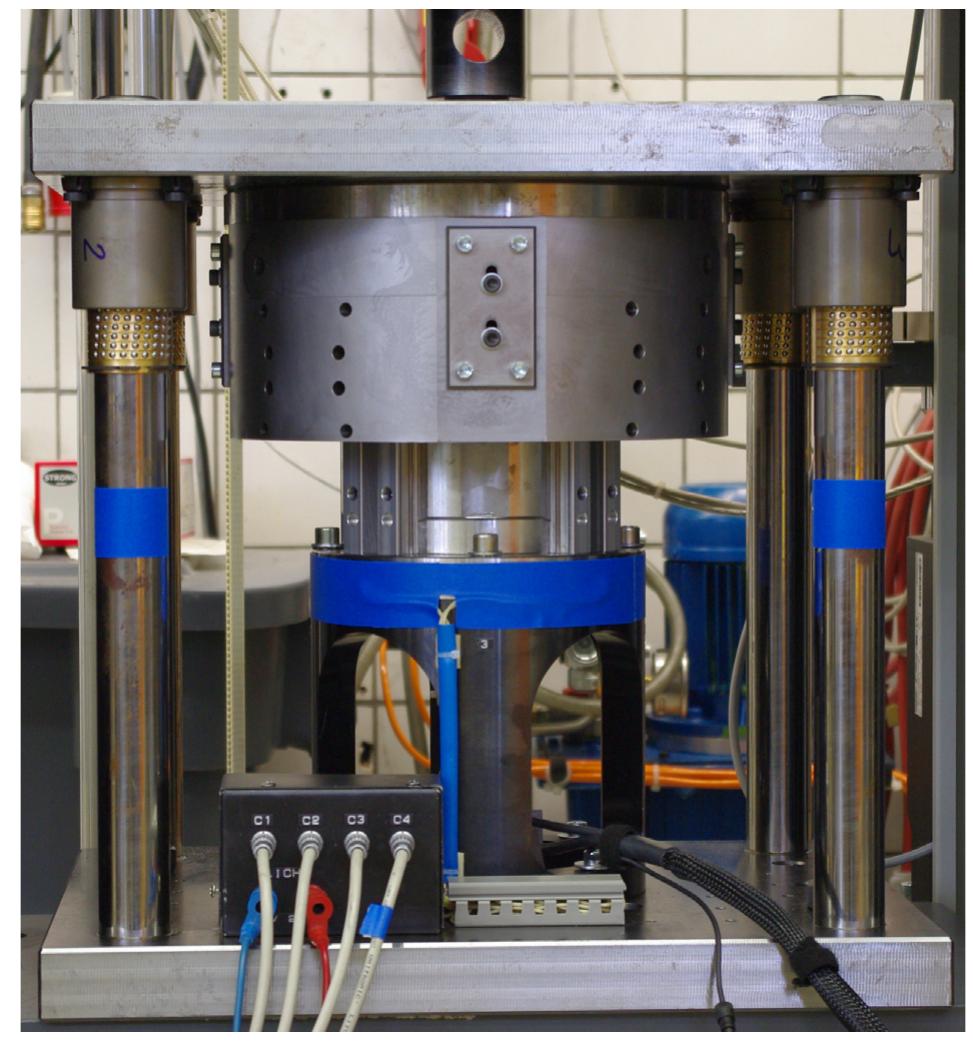 Biaxial test setup inside a universal testing machine.