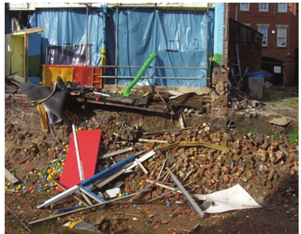 Collapse of wall on shallow footing