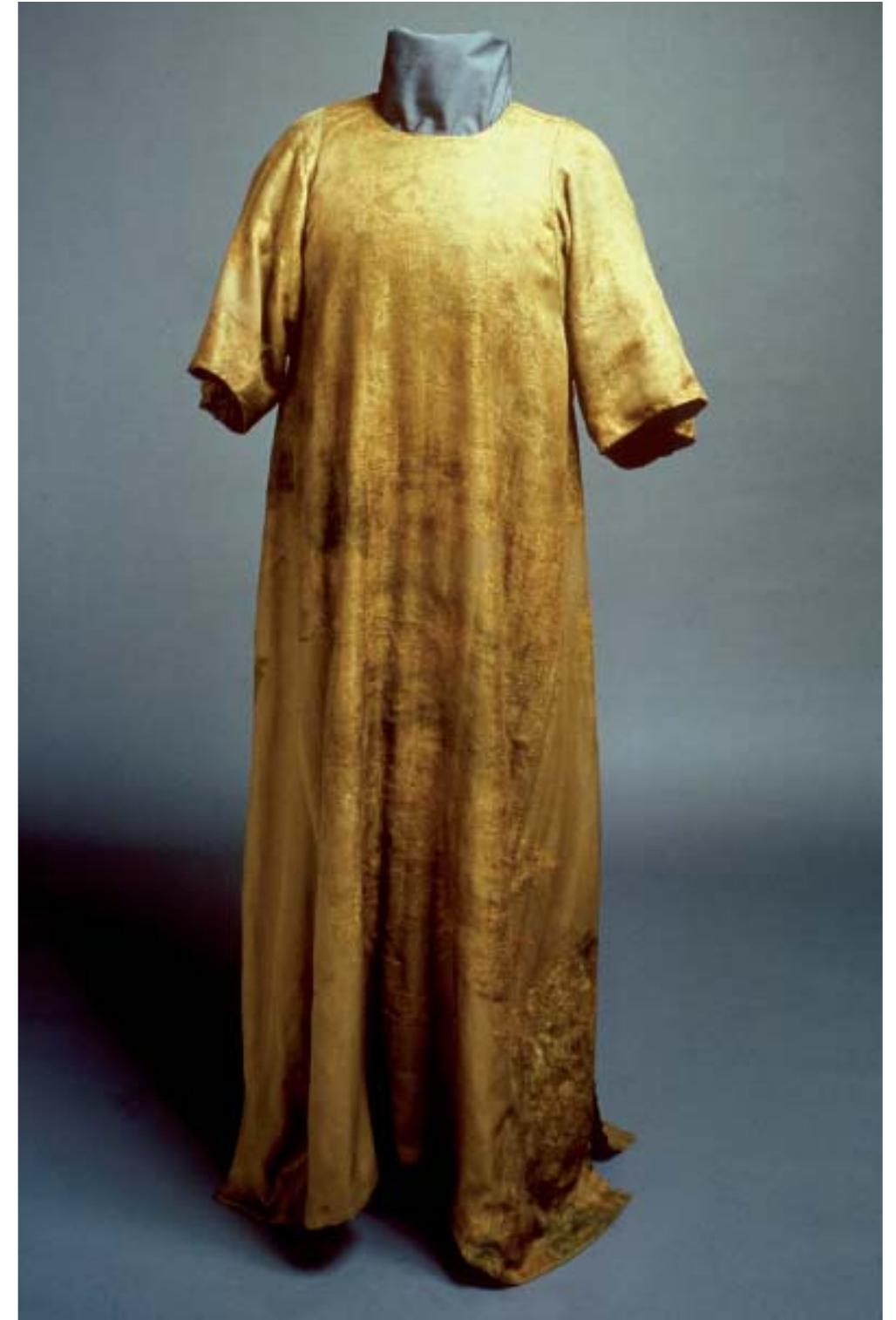 The fabric can be identified as middle eastern from the 13th