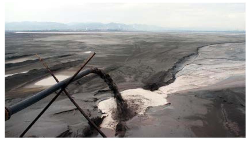 1: pipes pouring polluted water from a rare earth smelting